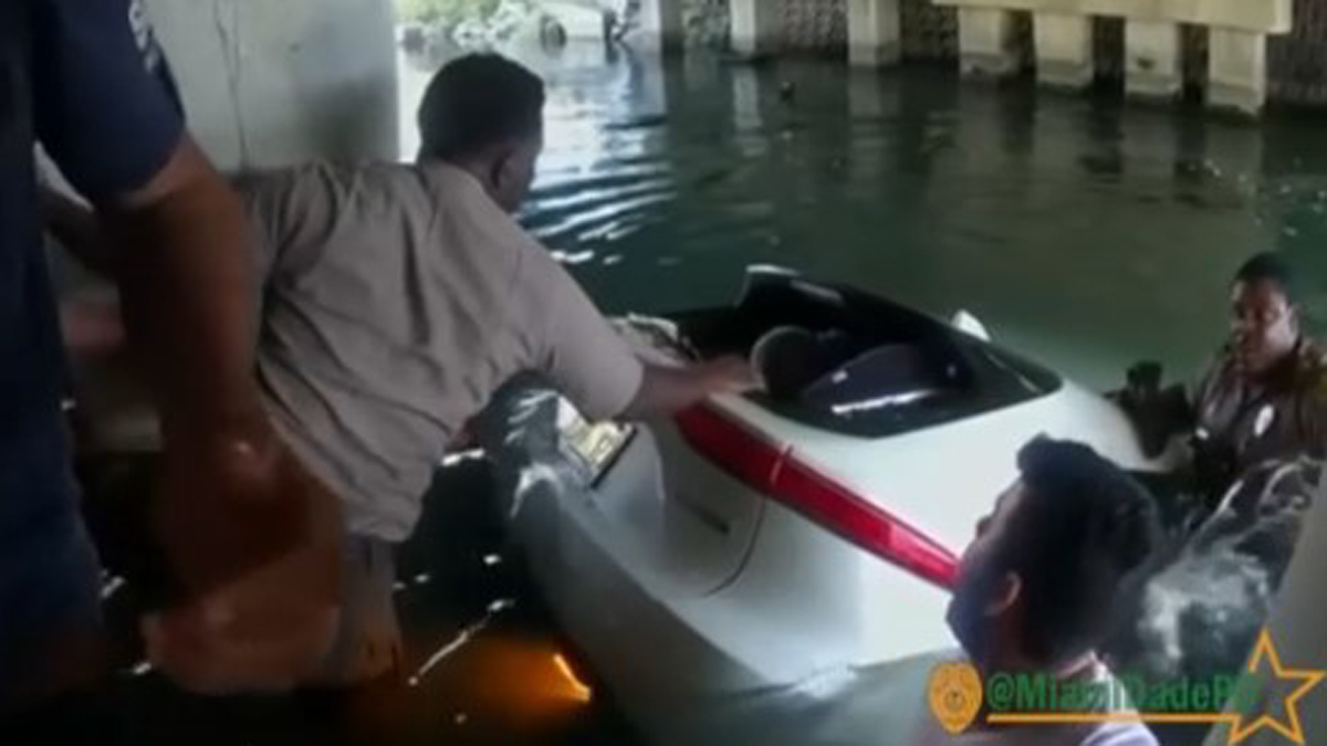 Video Shows Miami-Dade Officers Rescuing Boy Trapped in Submerged Car ...