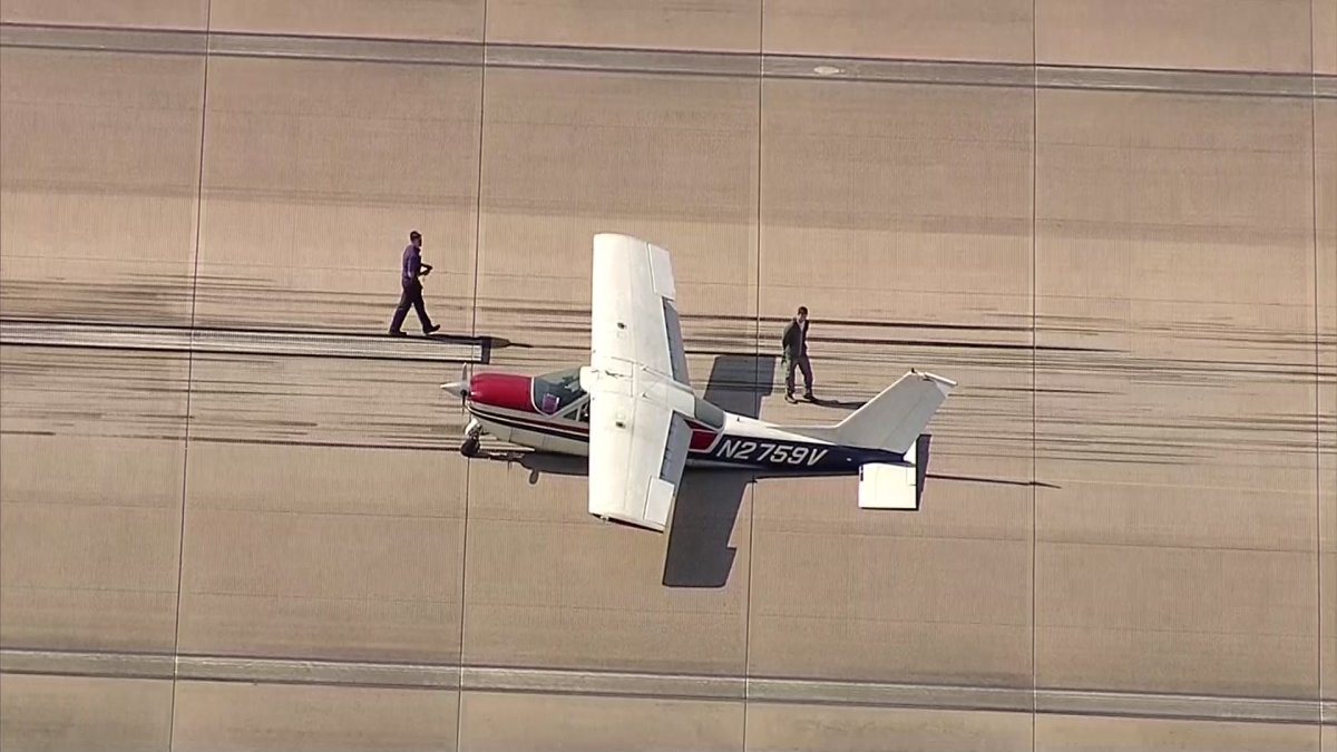 WATCH: Small plane makes belly landing at Dallas Executive Airport ...