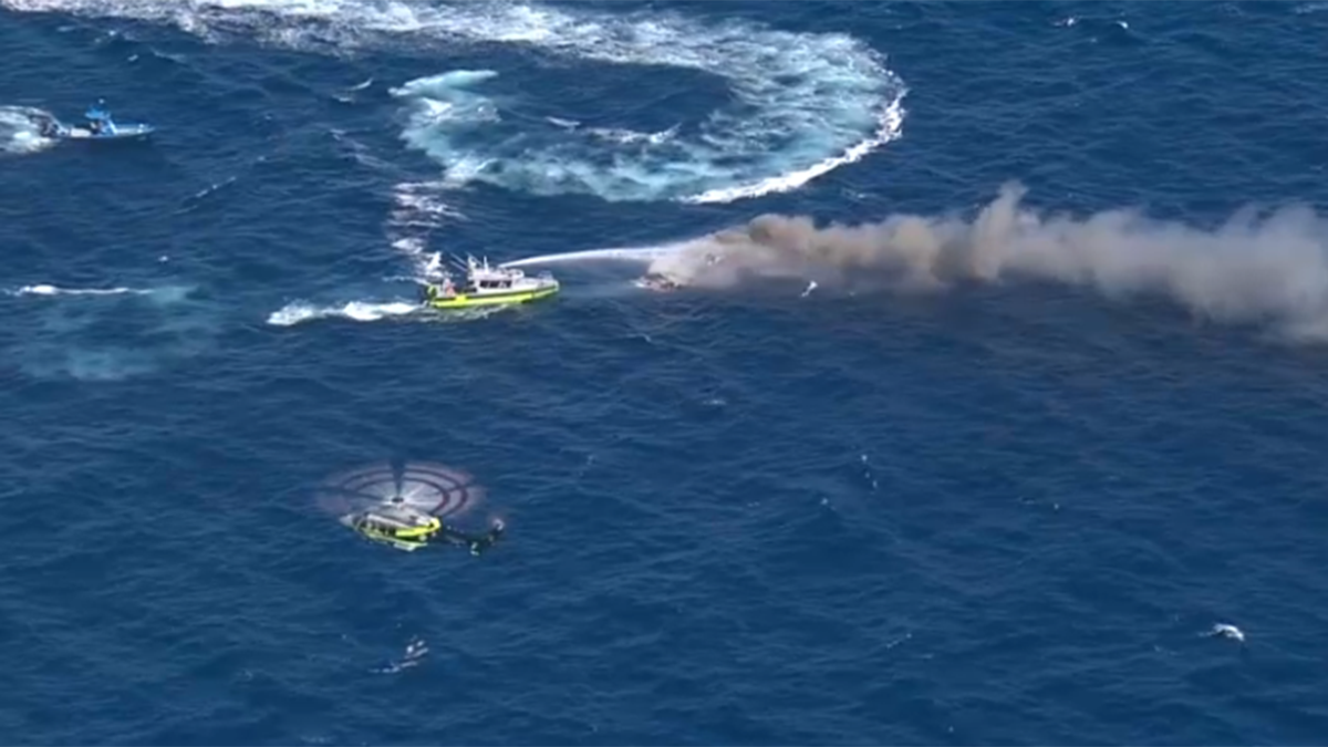 2 people safe after boat consumed by fire in ocean off Dania Beach ...