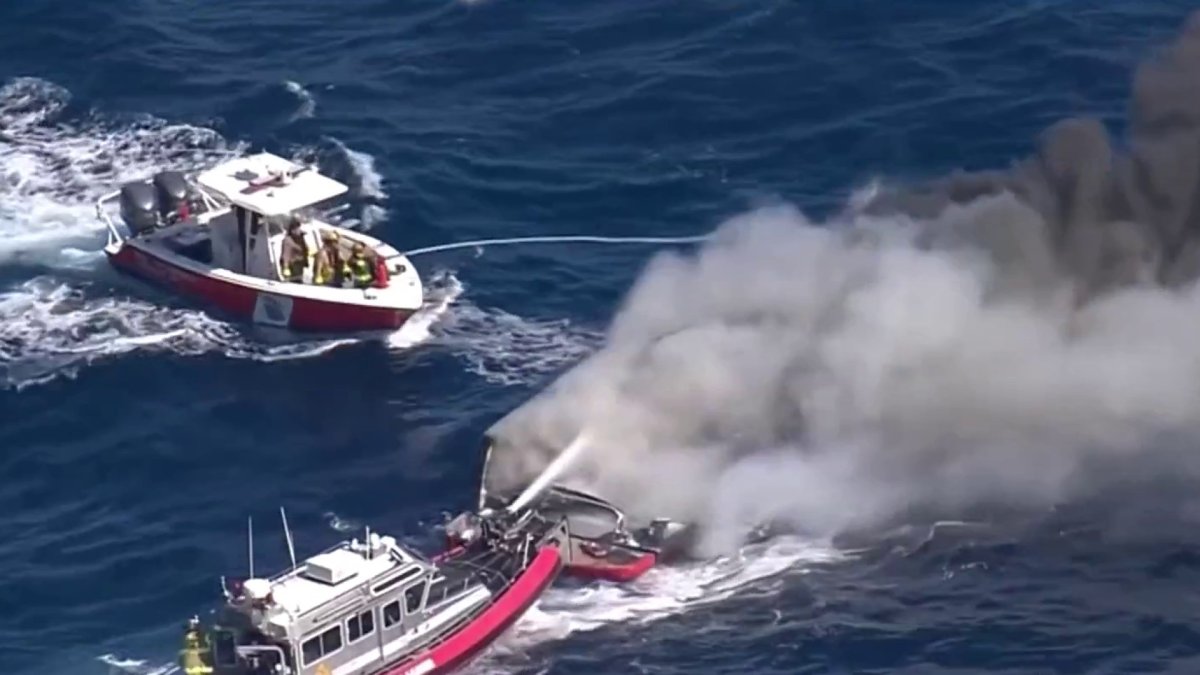 2 people safe after boat consumed by fire in ocean off Dania Beach ...