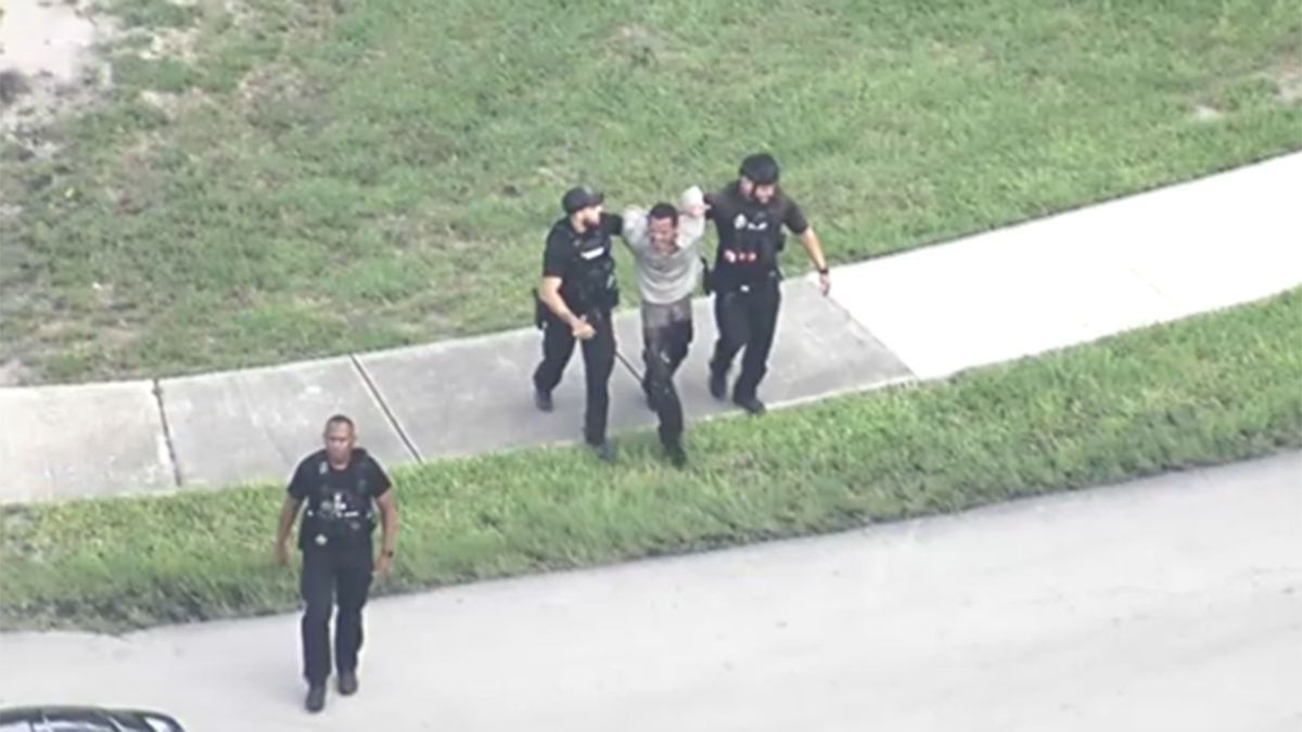 Video shows suspect taken into custody after pursuit and foot chase ...